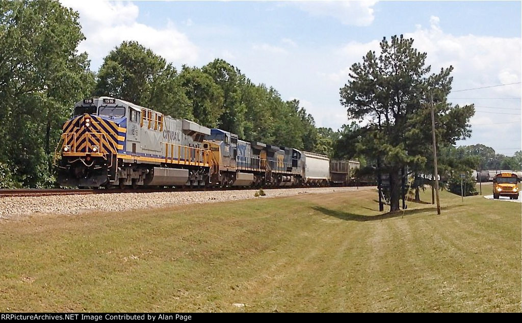 CREX ES44AC 1516 leads CSX C40-8Ws 7796 and 7906